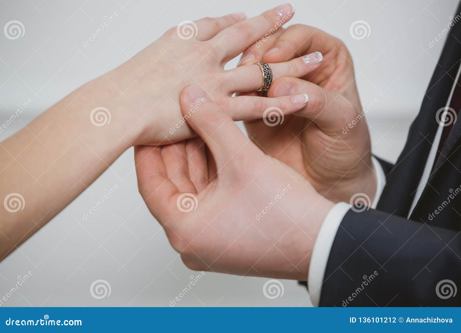 Groom Put a Ring on Finger of His Lovely Wife. Stock Photo - Image of ... Groom Put a Ring on Finger of His Lovely Wife. Stock Photo - Image of ...