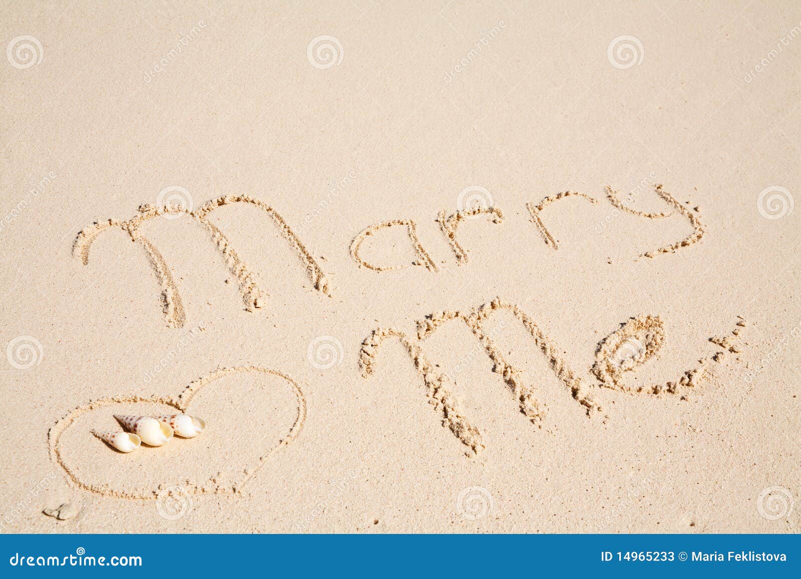 Marry me written on sand stock image. Image of fiancee - 14965233