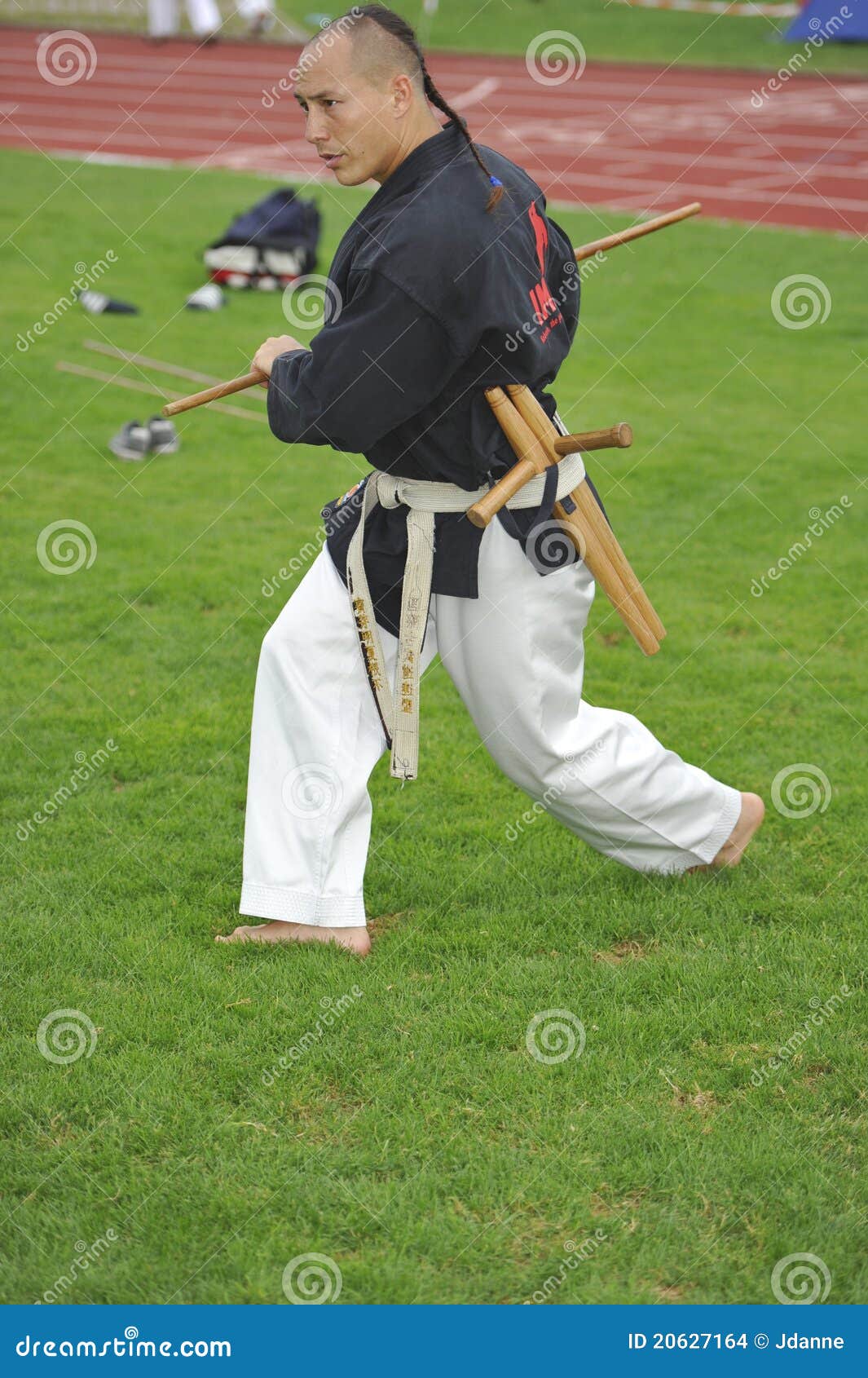 Martial Art Master Benj Lee with Bo and Tonfa Editorial Stock Image ...