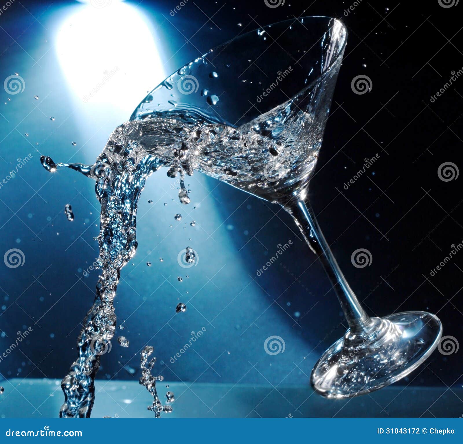 Martini glass with splash stock photo. Image of studio - 31043172
