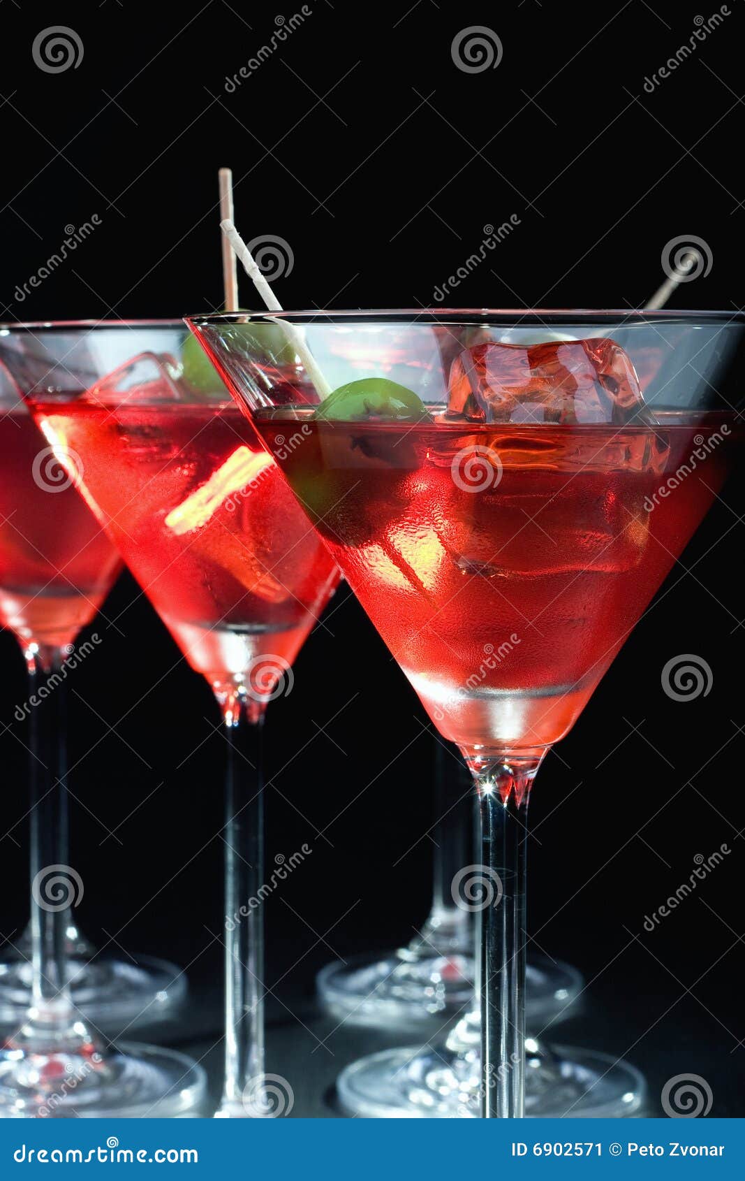Martini Glasses with Olive and Ice Cube Stock Image - Image of cocktail ...