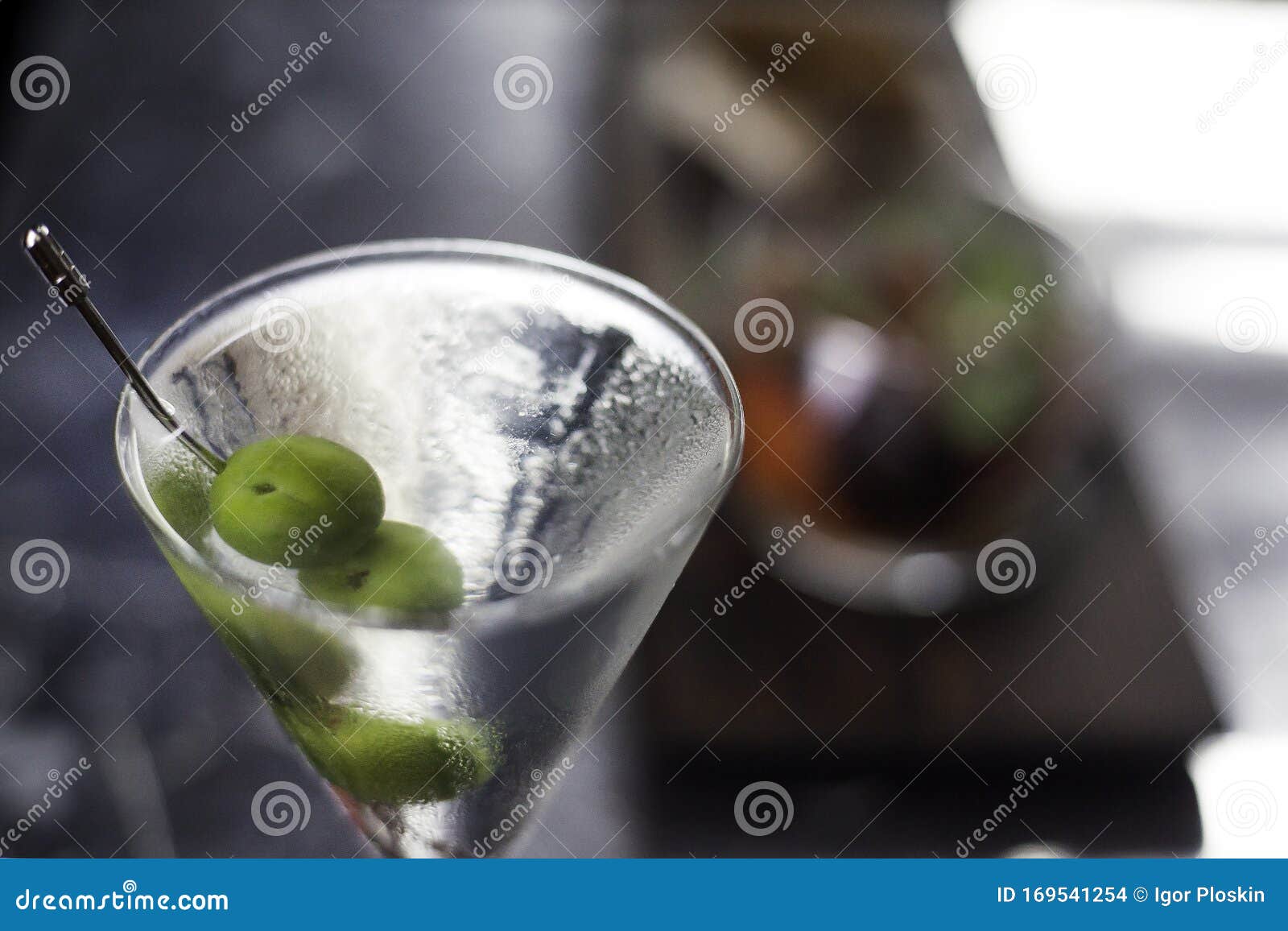 Martini with olives stock photo. Image of closeup, aperitif - 169541254