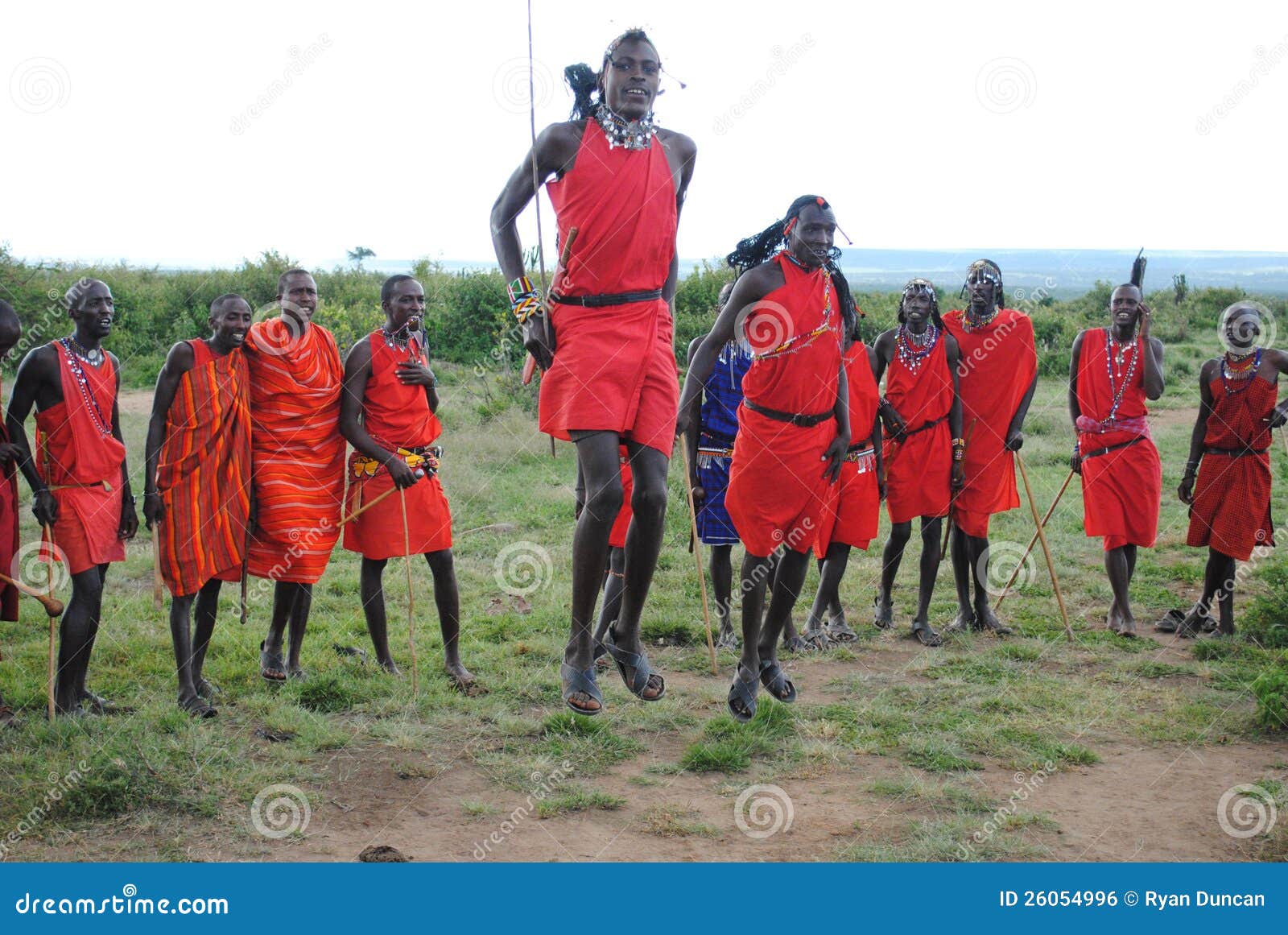 Masai Tribal Members In Colorful Wraps Called Shukas Perform The ...