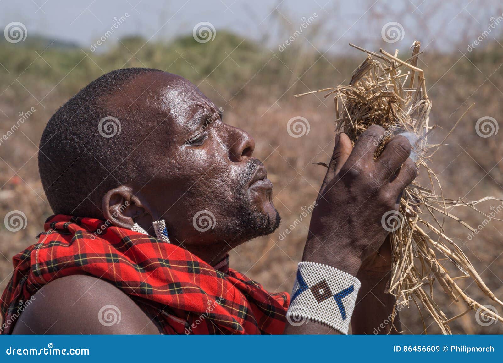 Masai warrior making fire editorial stock image. Image of colourful ...