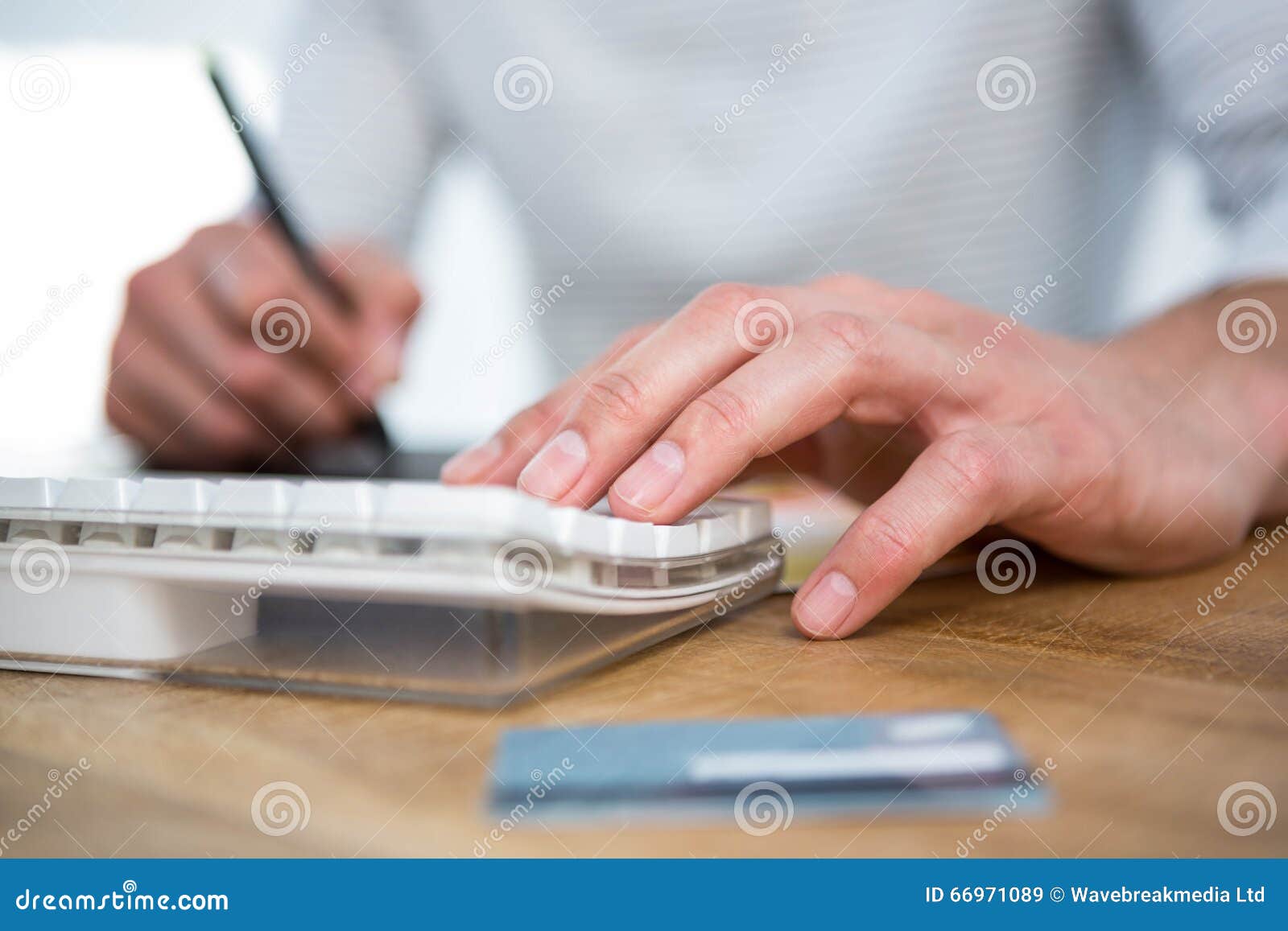 Masculine Hands Taking Notes and Typing on Keyboard Stock Image - Image ...
