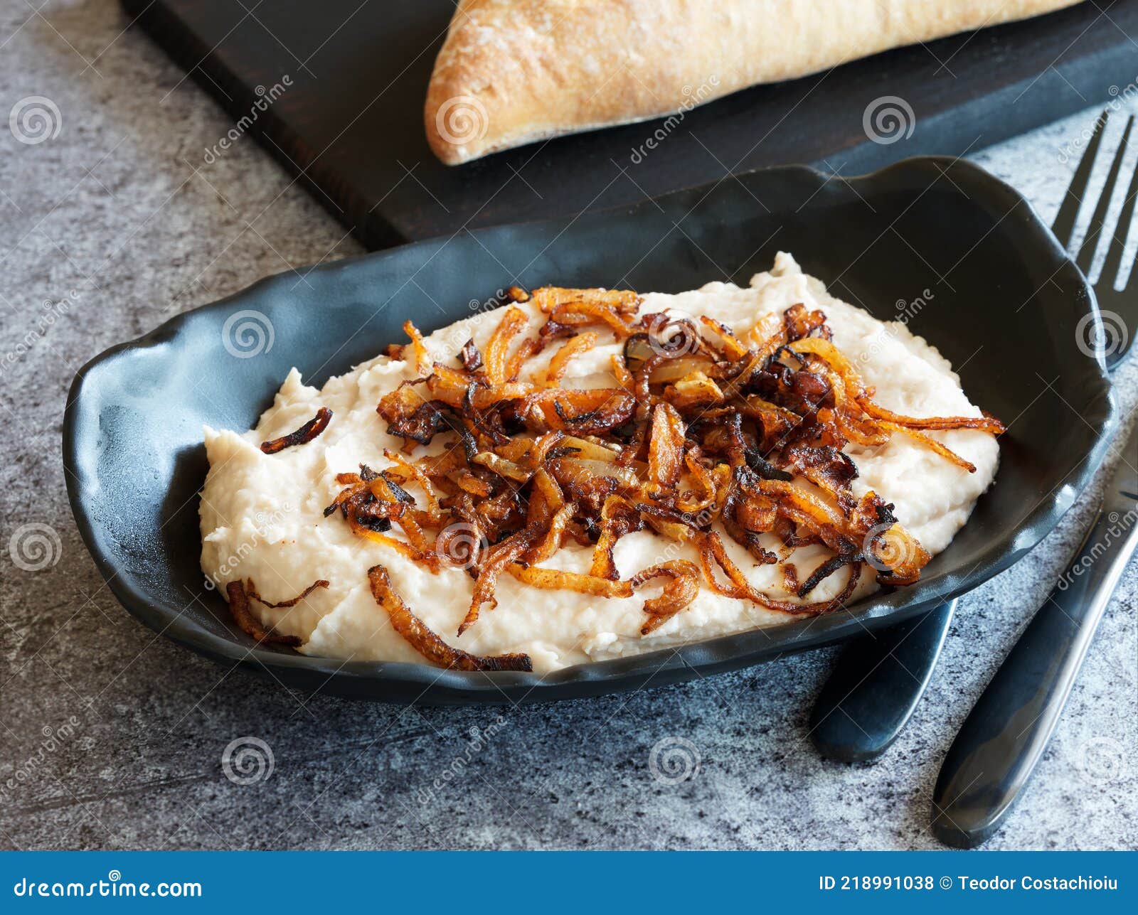 Mashed Beans Spread with a Topping of Sauteed Onions and Tomato Paste ...