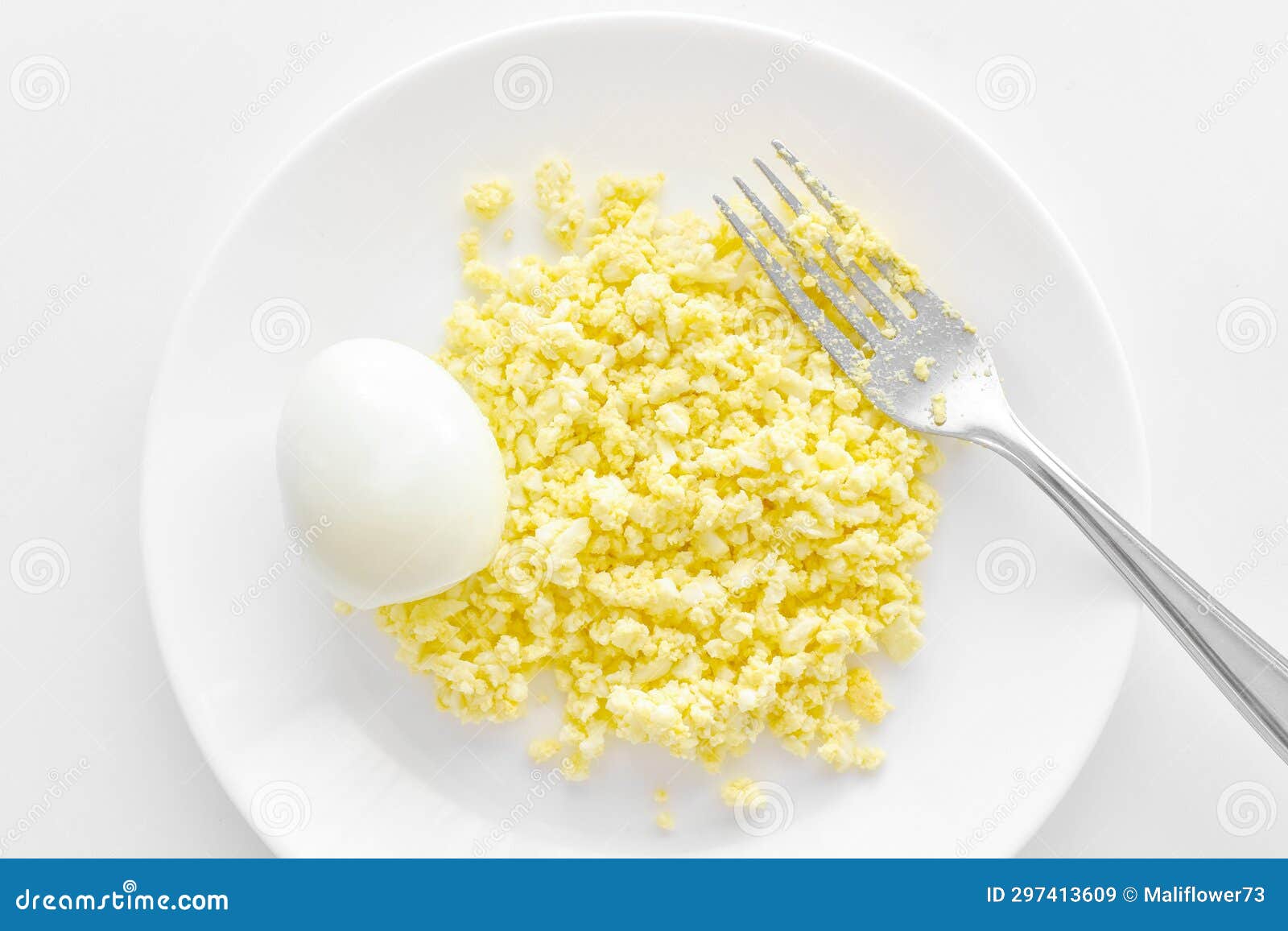 Mashed Boiled Egg with a Fork on a White Plate. Stock Image - Image of ...