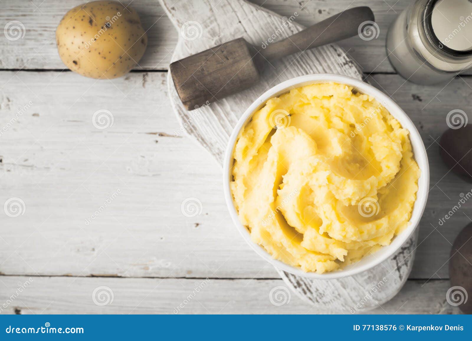 Mashed Potatoes in the Bowl on the White Wooden Table with Bottle of ...