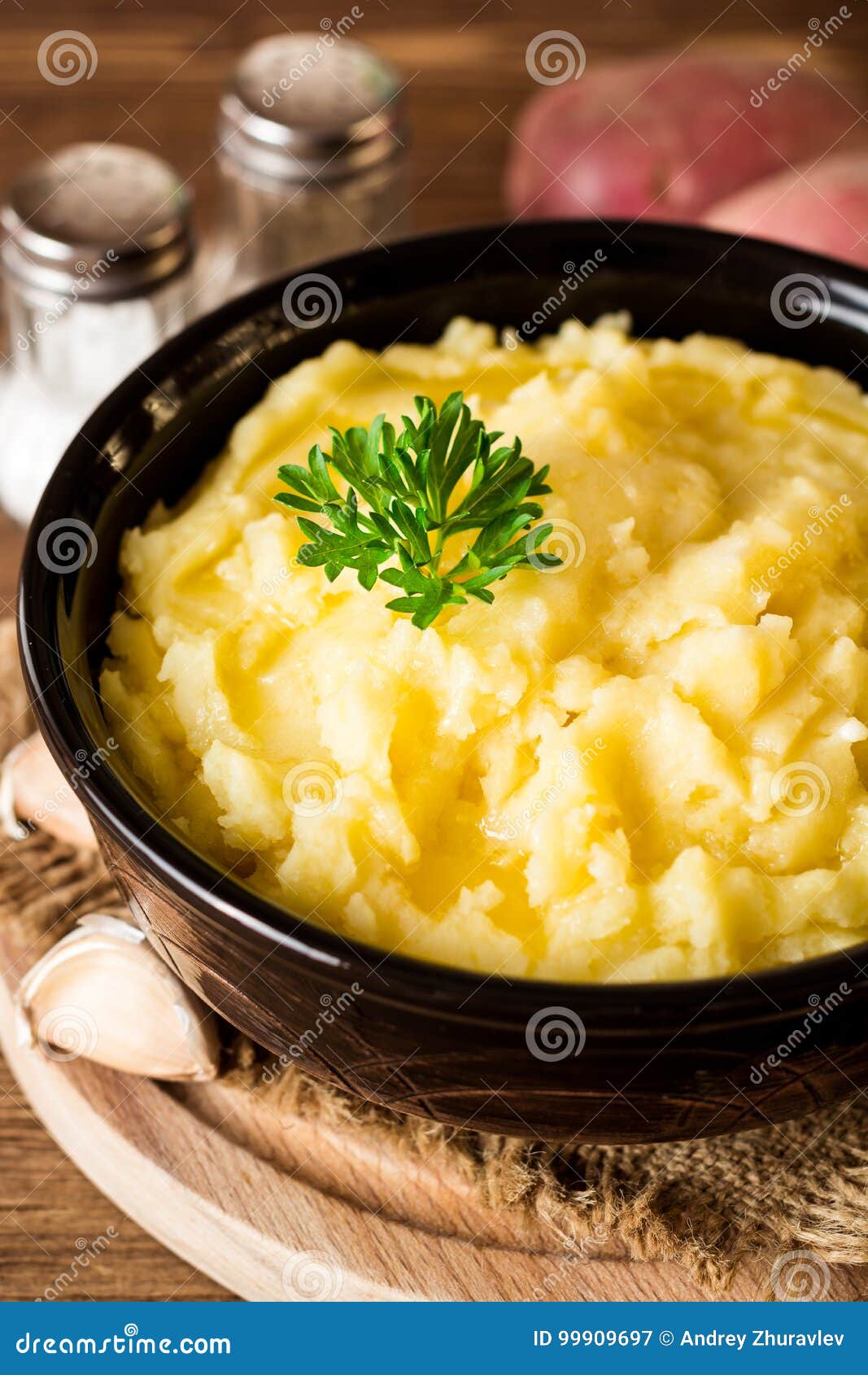 Mashed Potatoes with Butter and Fresh Parsley in Bowl on Rustic Wooden ...