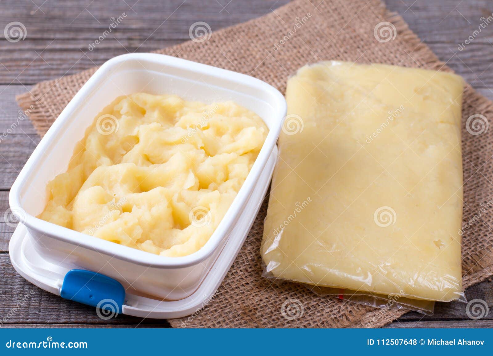 Mashed Potatoes in a Container and a Bag on a Table Stock Photo - Image ...