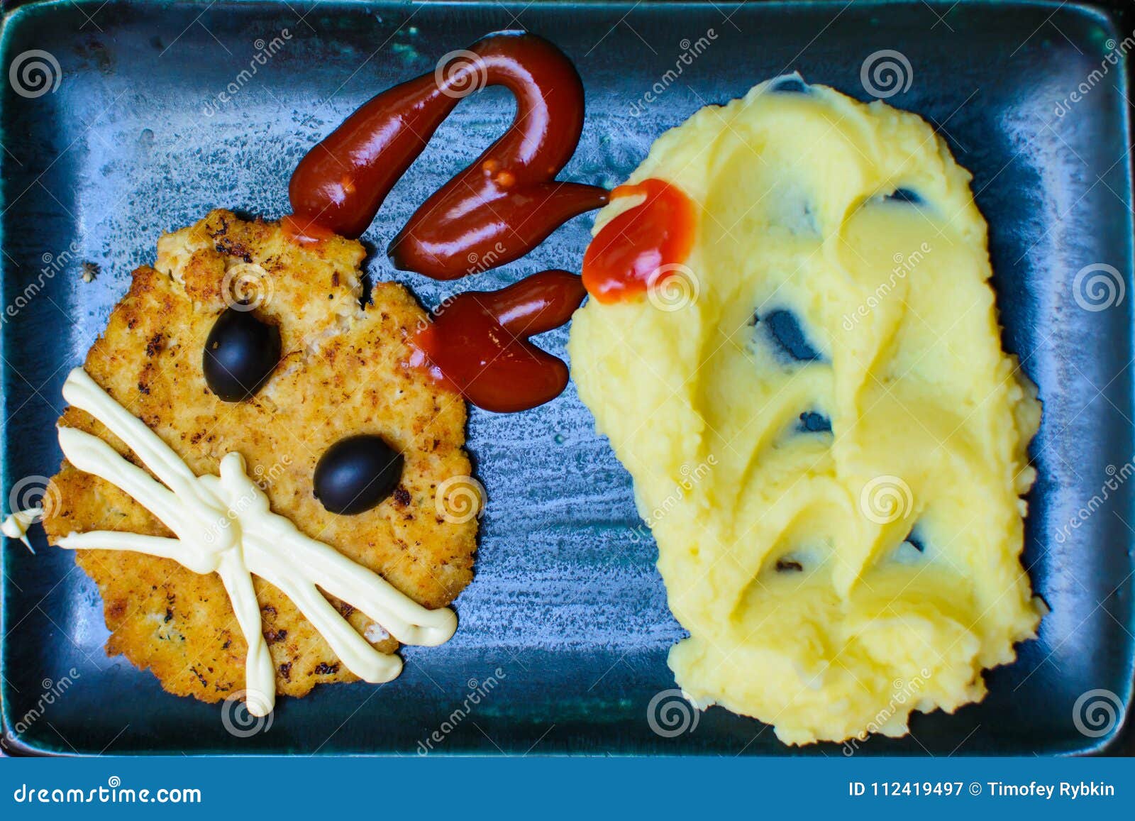 Mashed Potatoes and Cutlet Decorated for the Child. Top View Stock ...