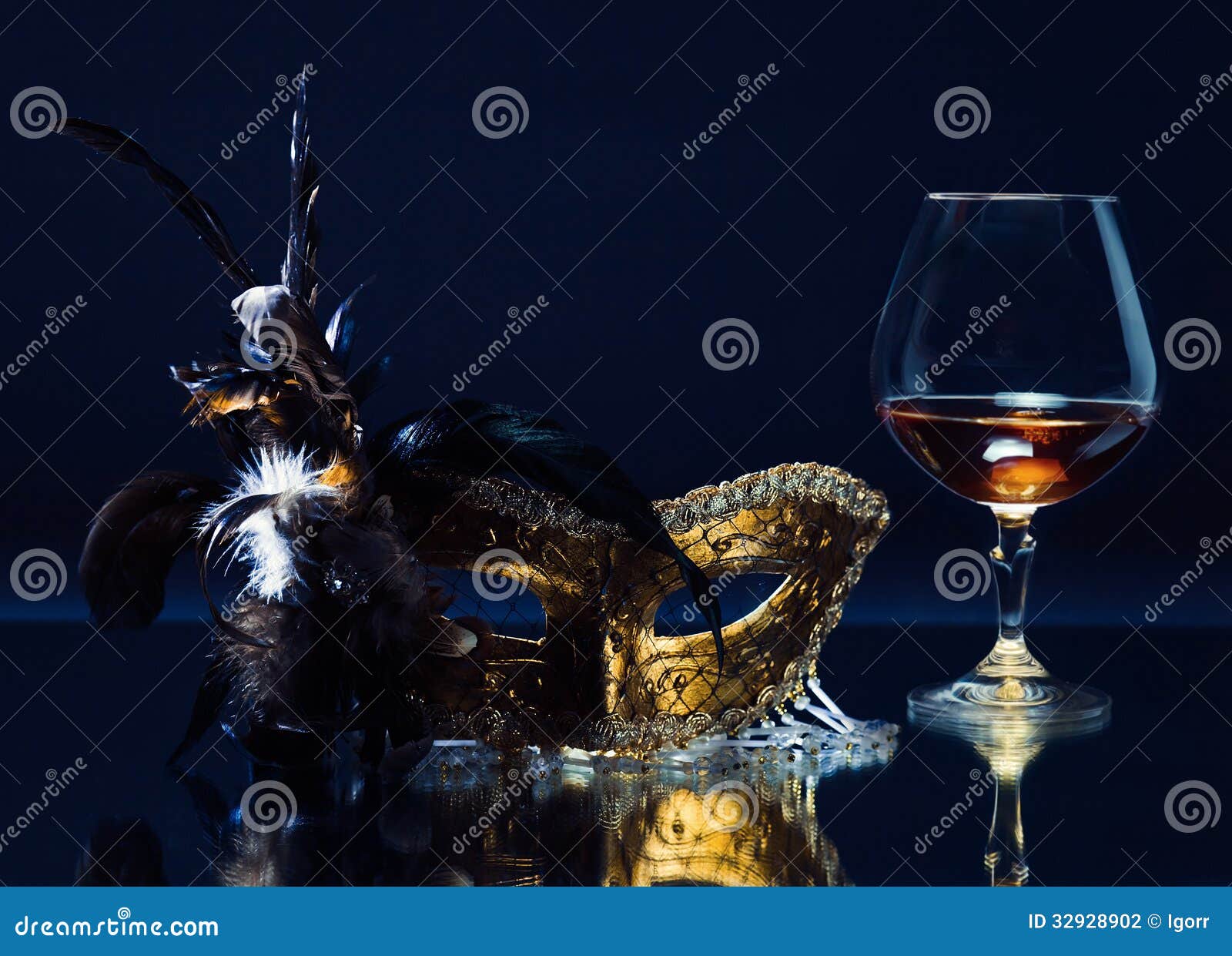 Mask with Feather and Brandy on a Mirror Table Stock Photo - Image of ...