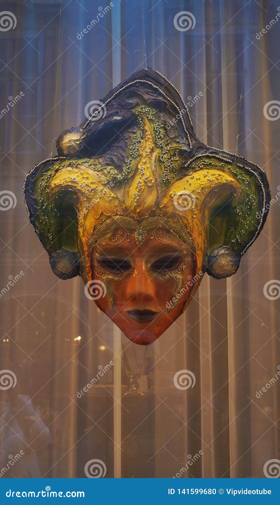 Mask of Jester Behind the Glass Stock Photo - Image of cover, carnivale ...