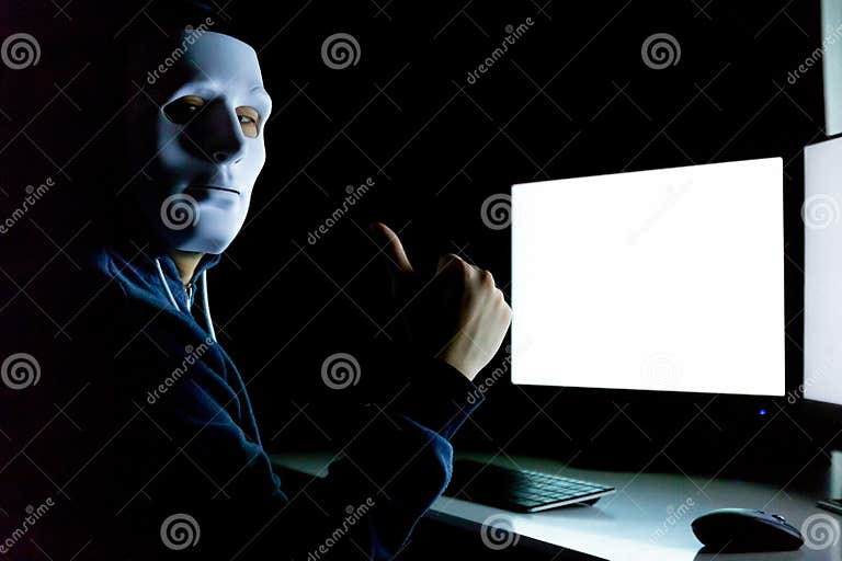 Masked and Anonymous Hacker Under Hood Giving Thumbs Up while Using a ...