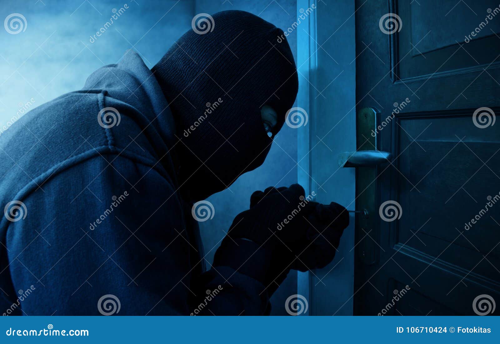 Masked Burglar Using Lock Picker To Open Locked Door Royalty-Free Stock ...