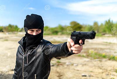 Masked gunman stock photo. Image of kill, holding, aiming - 24908508