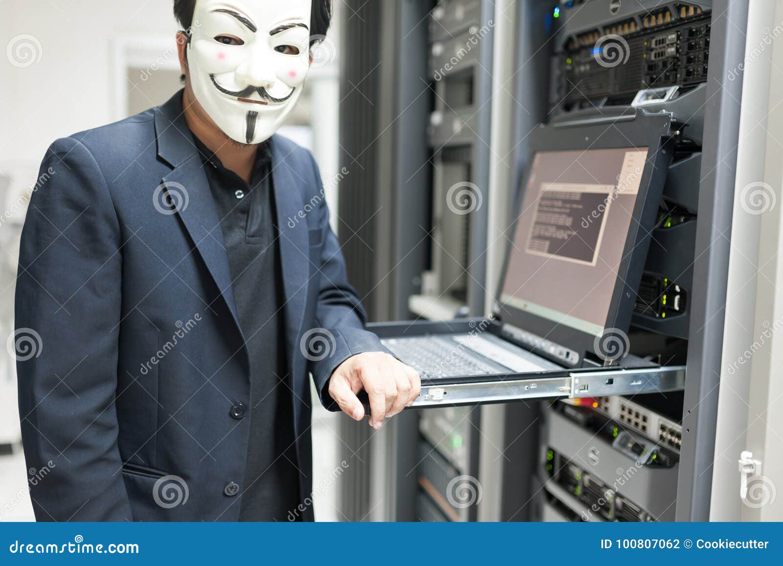 Masked Hacker in Computer Server Room Concept . Editorial Photography ...
