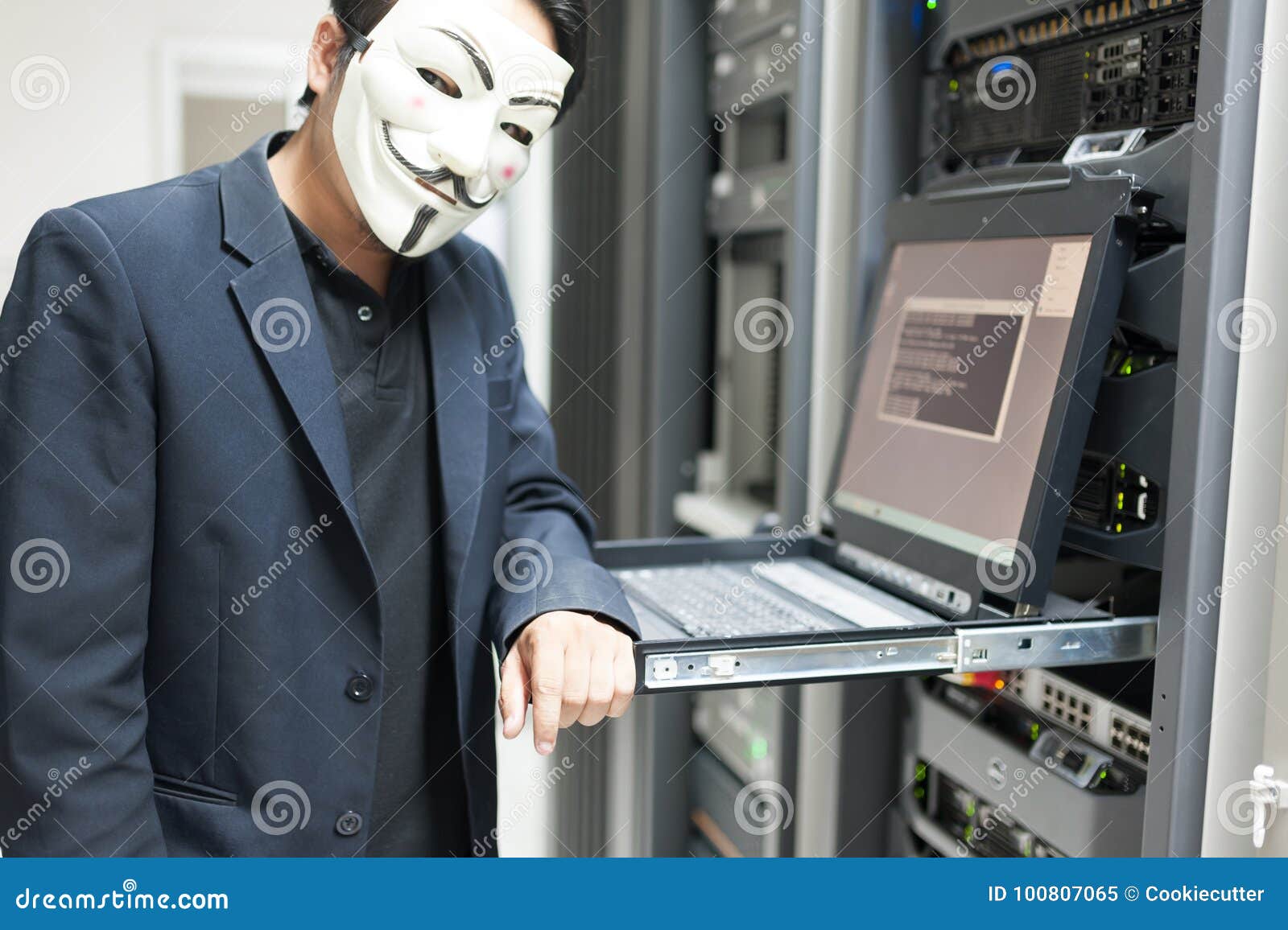 Masked Hacker in Computer Server Room Concept . Editorial Image - Image ...