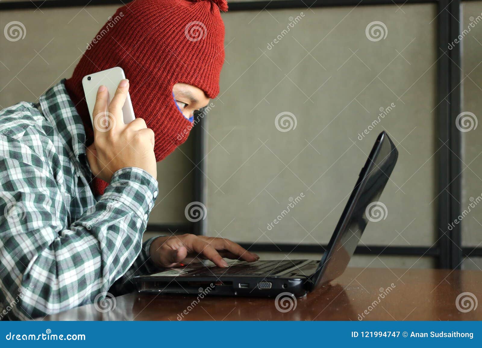 Masked Hacker Wearing A Hoodie To Hide His Identity Royalty-Free Stock ...