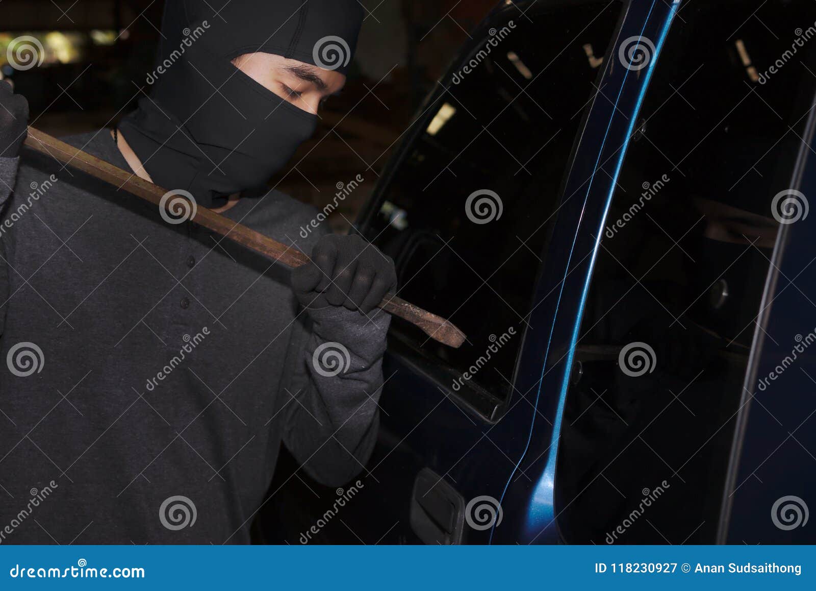 Man Using Crowbar To Open Glass Door Royalty-Free Stock Photography ...