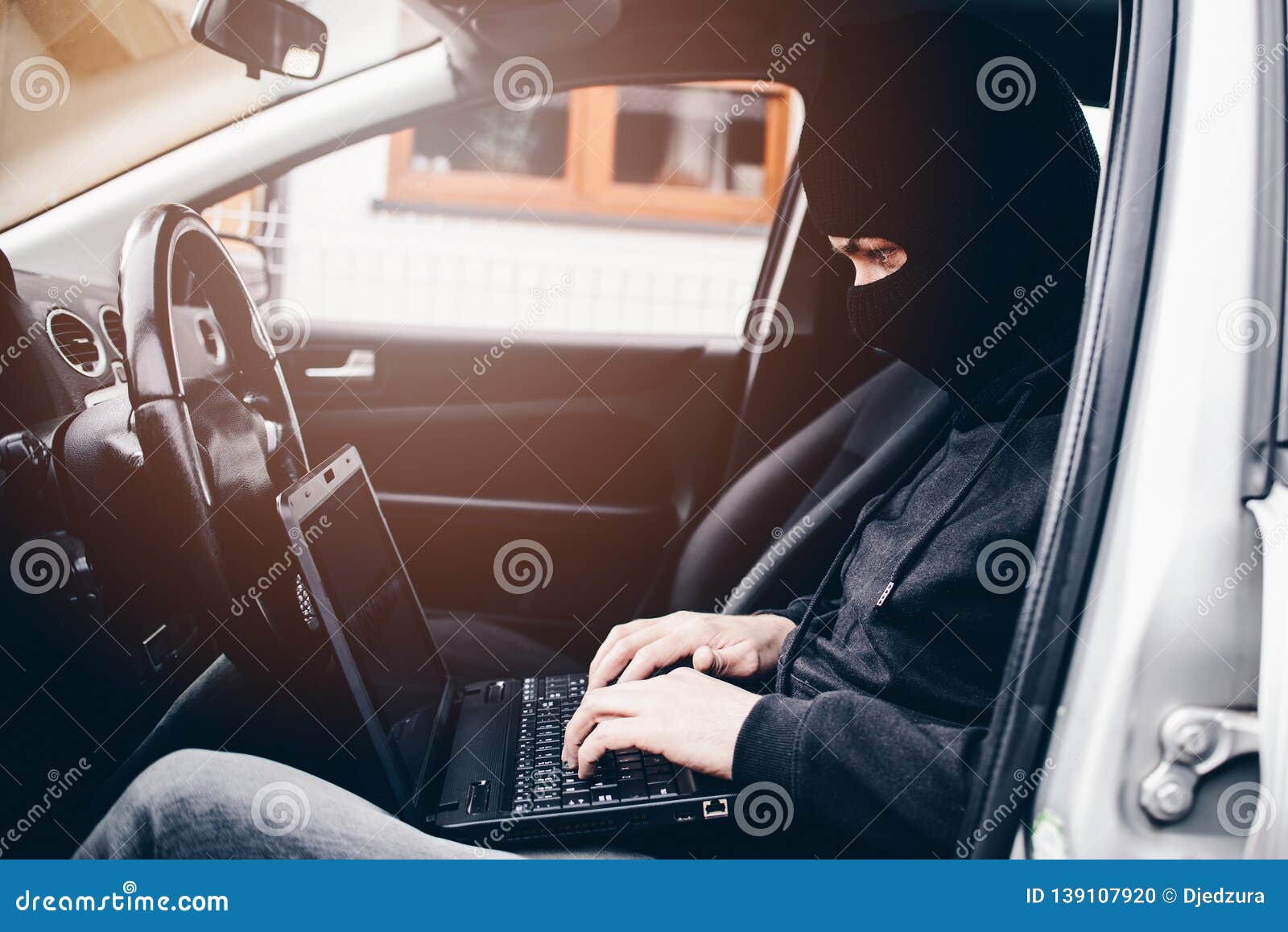 Masked Thief Hacker in a Balaclava Disarming Car Security Systems Stock ...