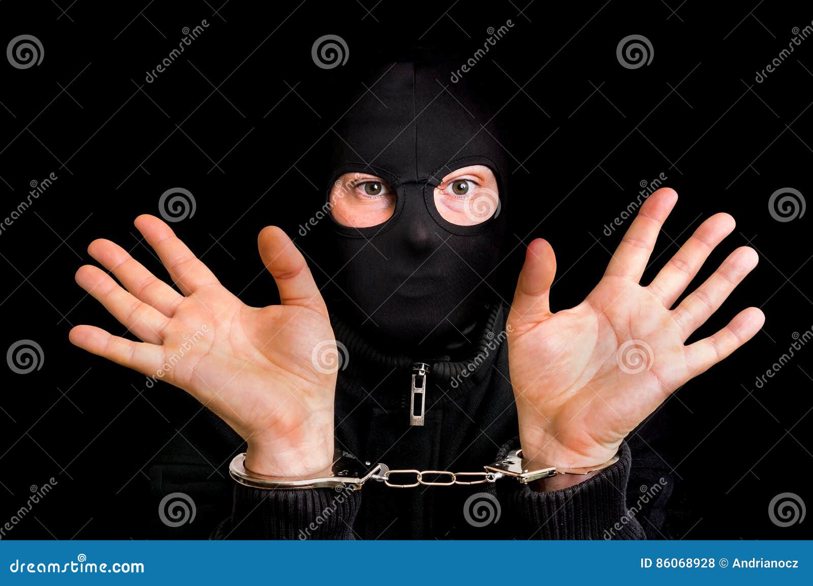Masked Thief in Handcuffs Isolated on Black Stock Photo - Image of ...