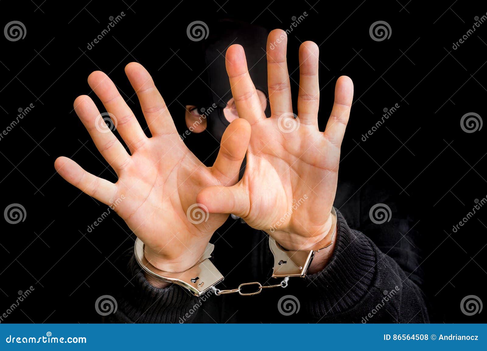 Masked Thief in Handcuffs Isolated on Black Background Stock Photo ...