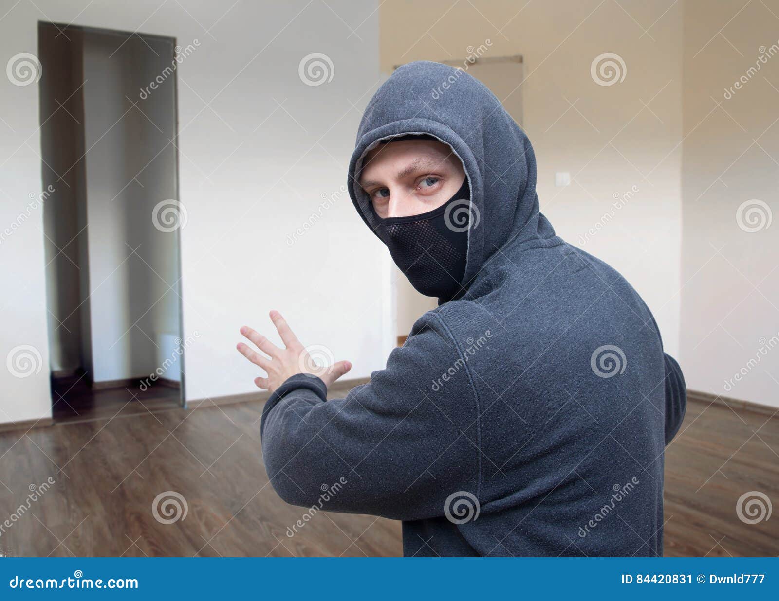 Masked Thief In Handcuffs Isolated On White Stock Photo | CartoonDealer ...