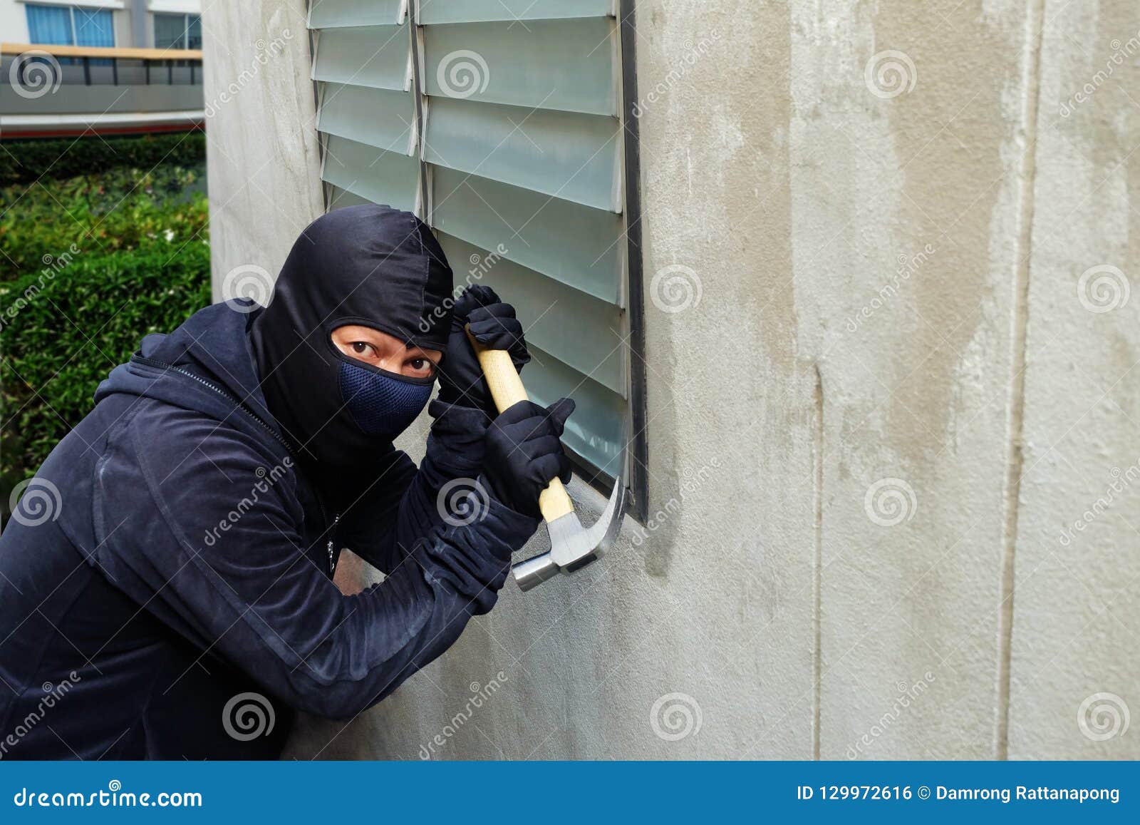 Masked Thief Using a Hammer Trying To Break Windows Stock Photo - Image ...