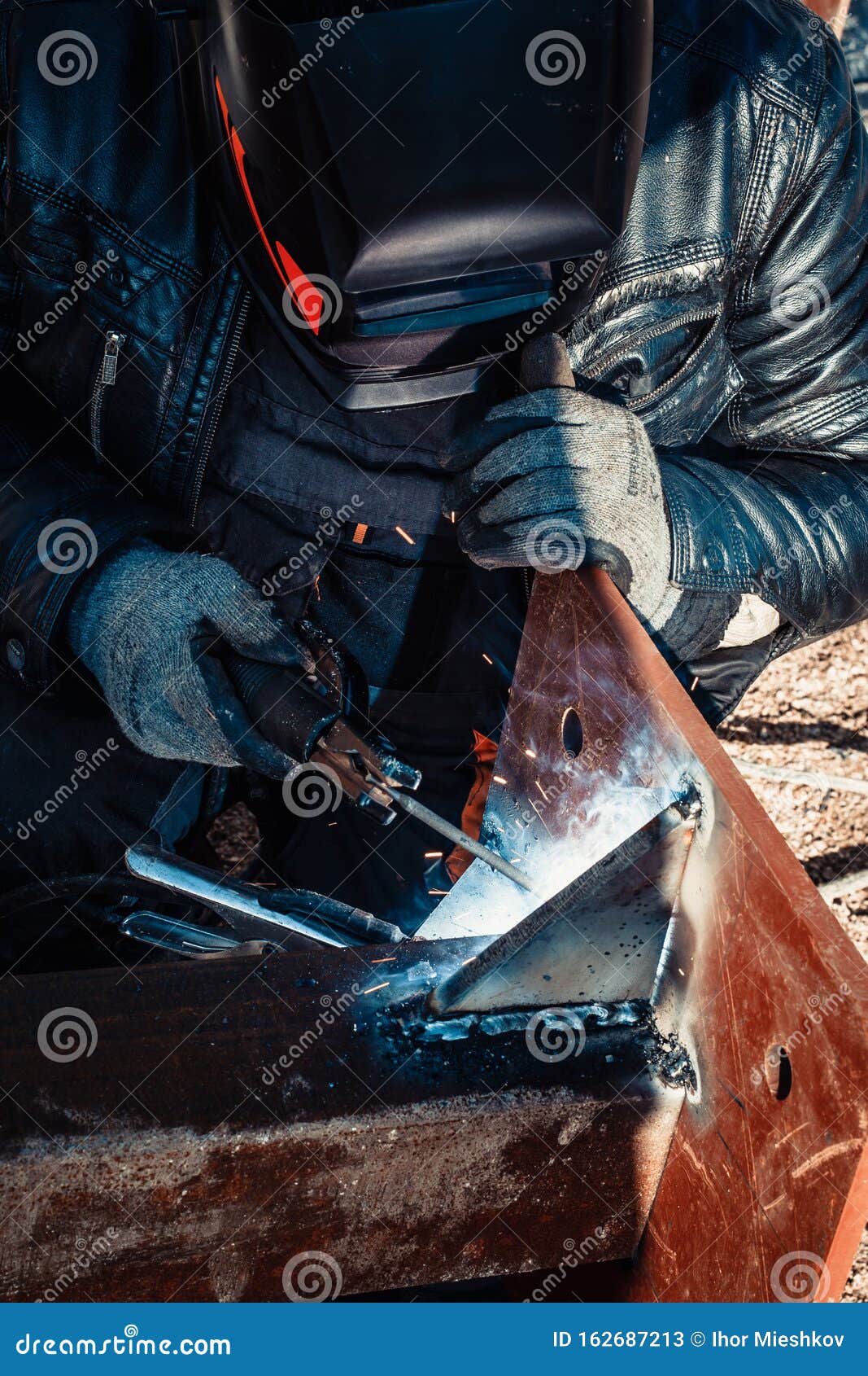 Masked Welder Welds Metal at a Construction Site Stock Image - Image of ...