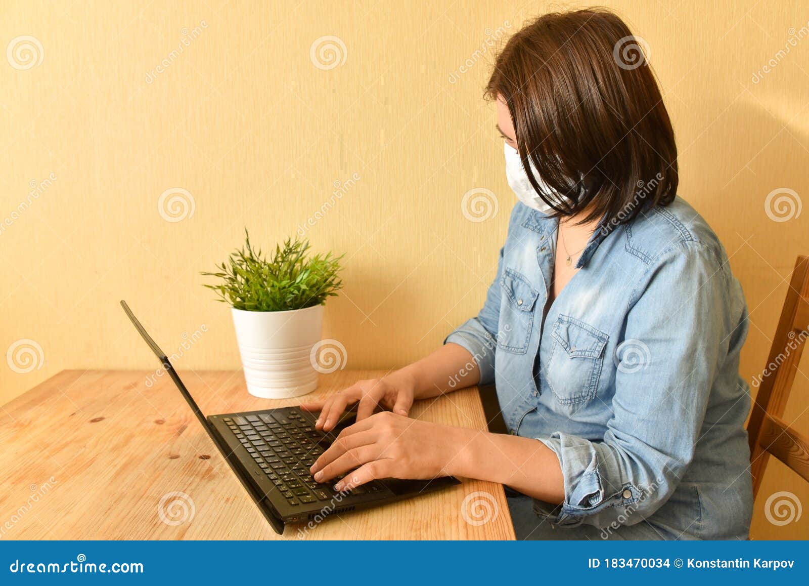 Masked Woman Works at the Computer in a Minimalistic Interior Stock ...