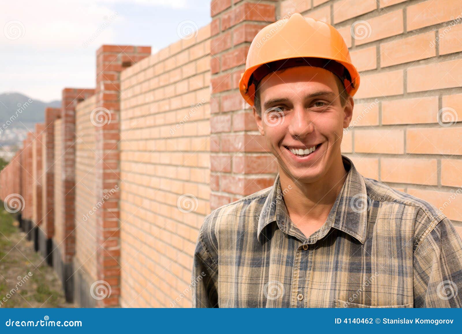 Young Mason Checking Plumb Line Of House Wall Being Made From Aerated ...