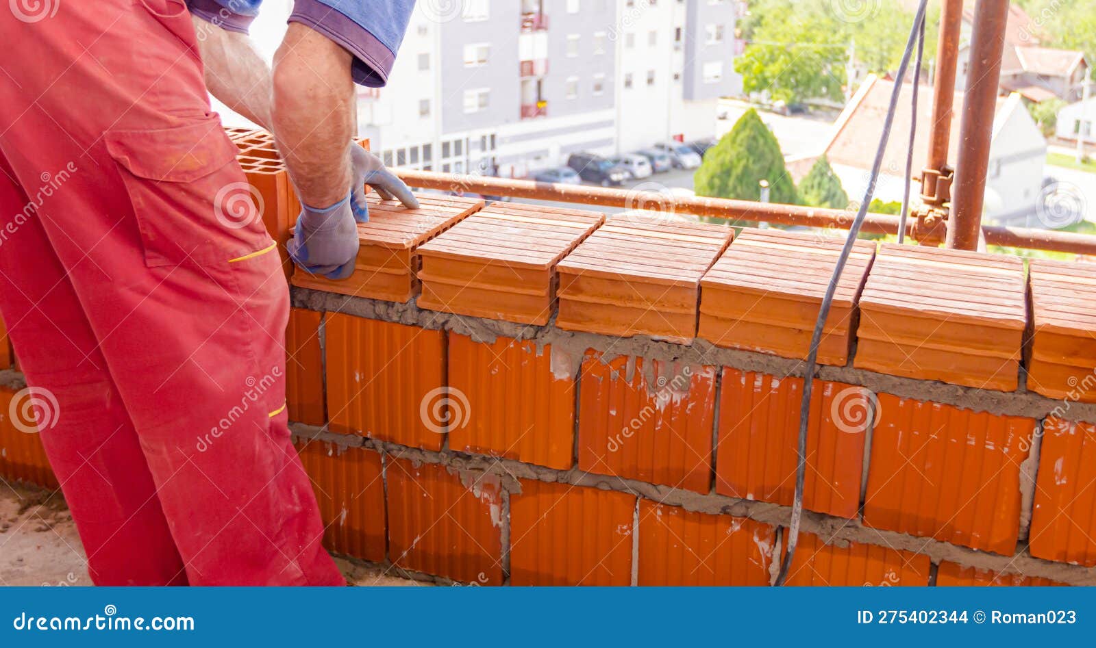 Worker is Building Wall with Red Blocks and Mortar Stock Photo - Image ...