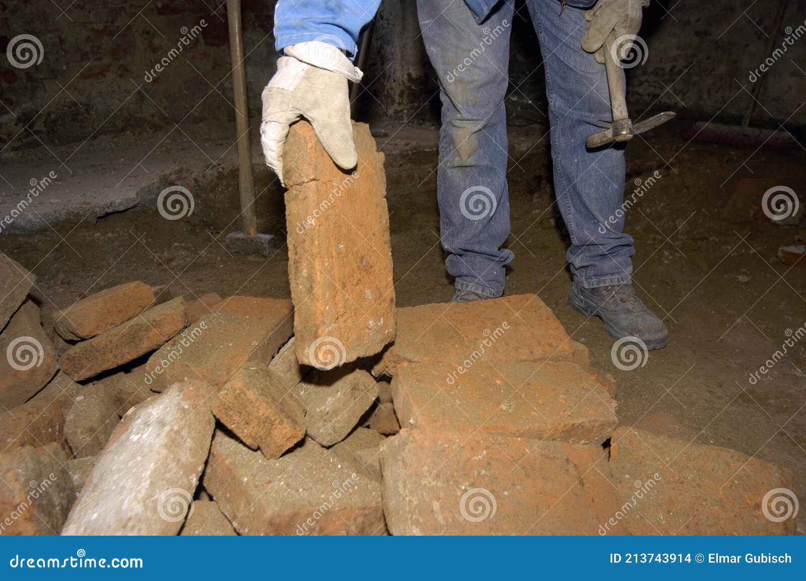 Mason builds a brick wall stock photo. Image of site - 213743914