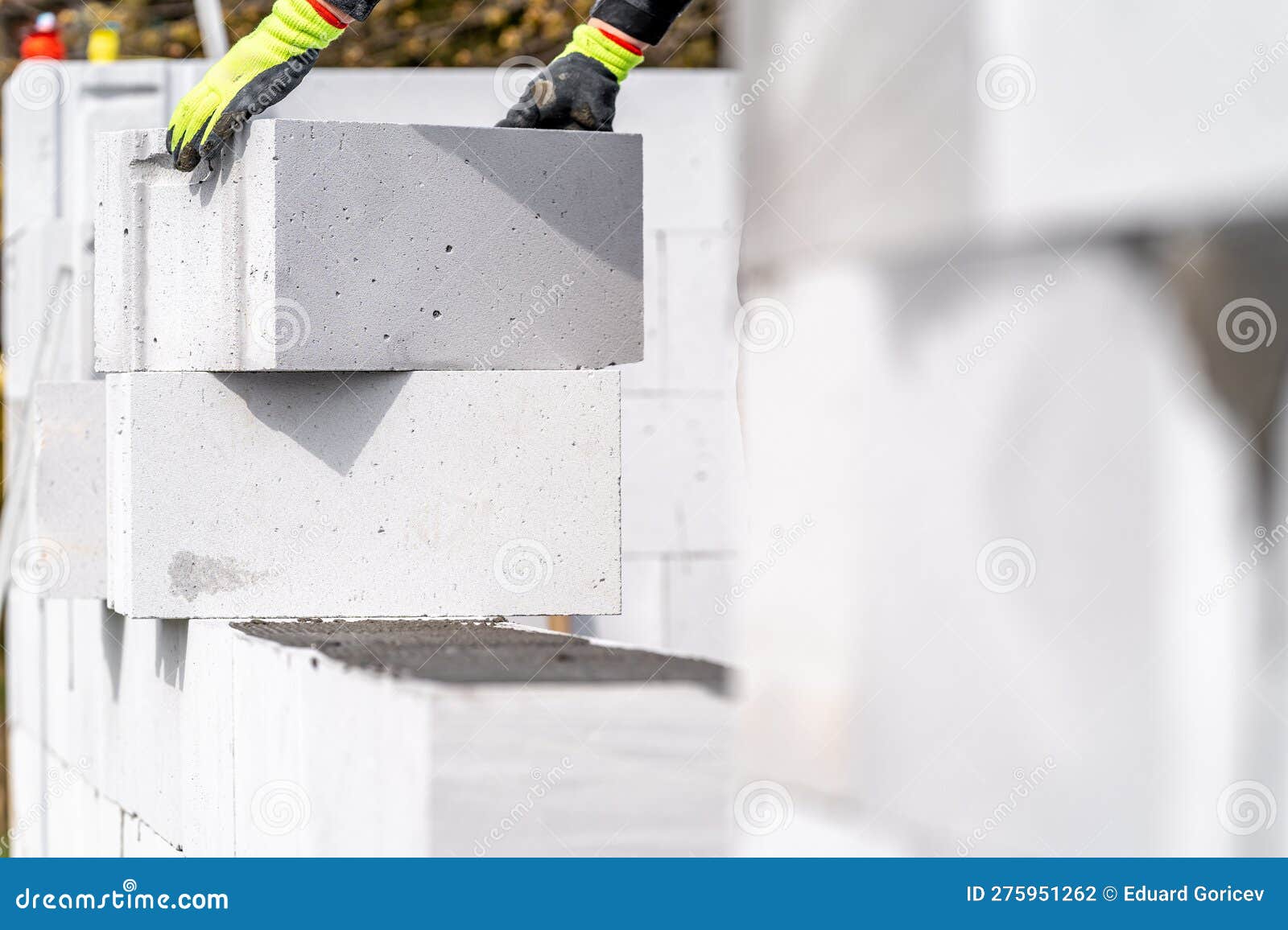A Mason Builds the Wall of a House with Bricks Stock Photo - Image of ...
