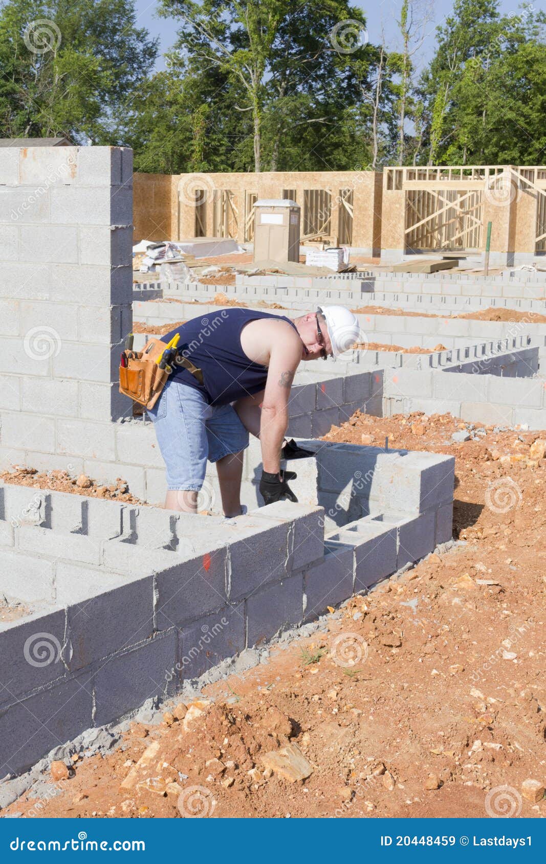 Mason with Concrete Block stock image. Image of lumber - 20448459