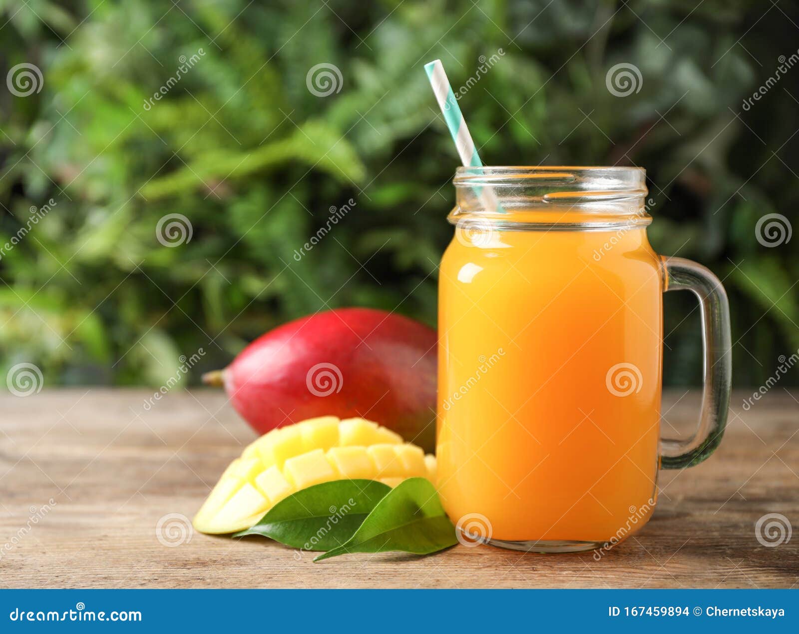 Mason Jar of Mango Drink on Wooden Table. Space for Text Stock Photo ...