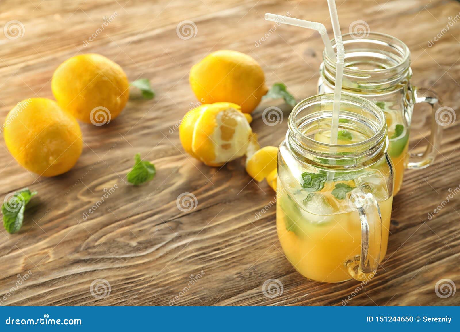 Mason Jars of Fresh Lemon Juice on Wooden Table Stock Photo - Image of ...