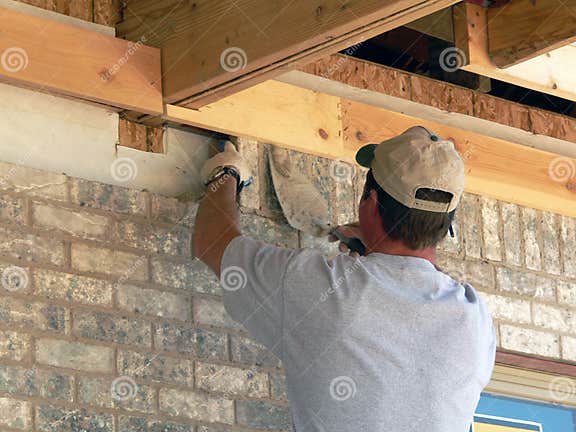 Mason laying brick stock photo. Image of tradesman, brick - 2112276