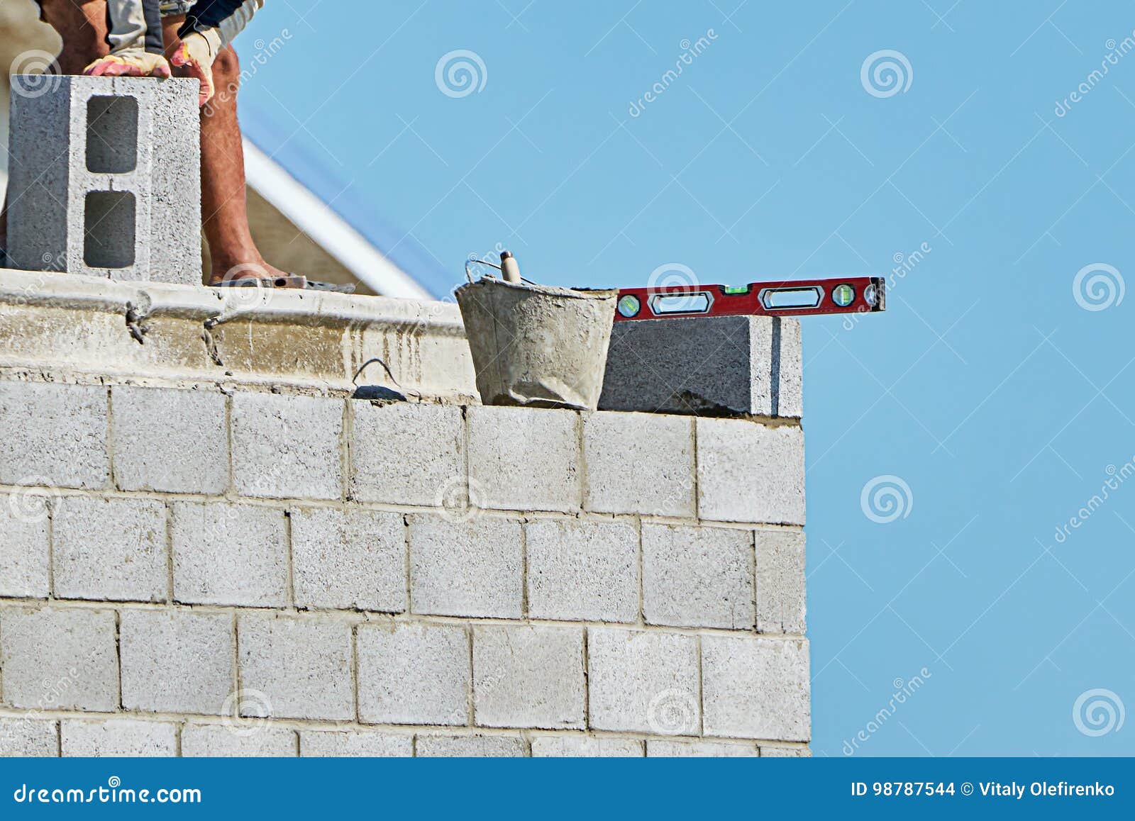 Mason on laying bricks stock photo. Image of build, stone - 98787544