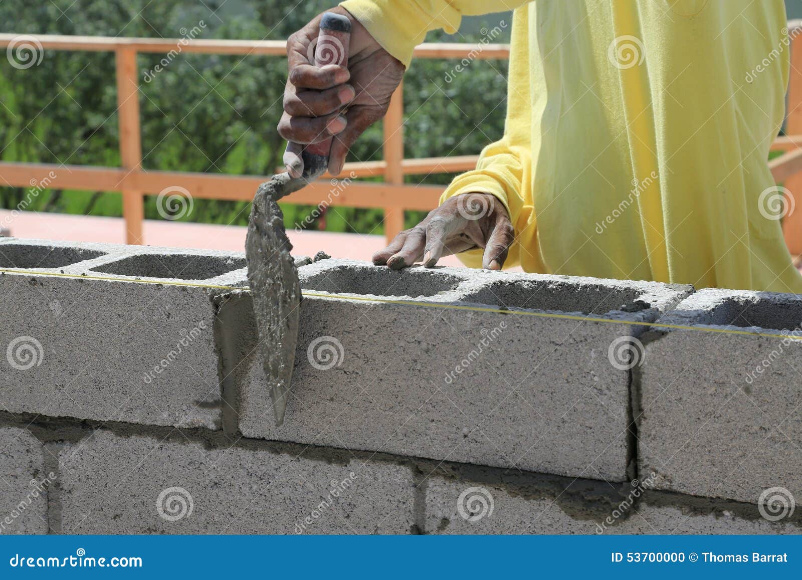 Mason laying a new wall stock photo. Image of bricklaying - 53700000