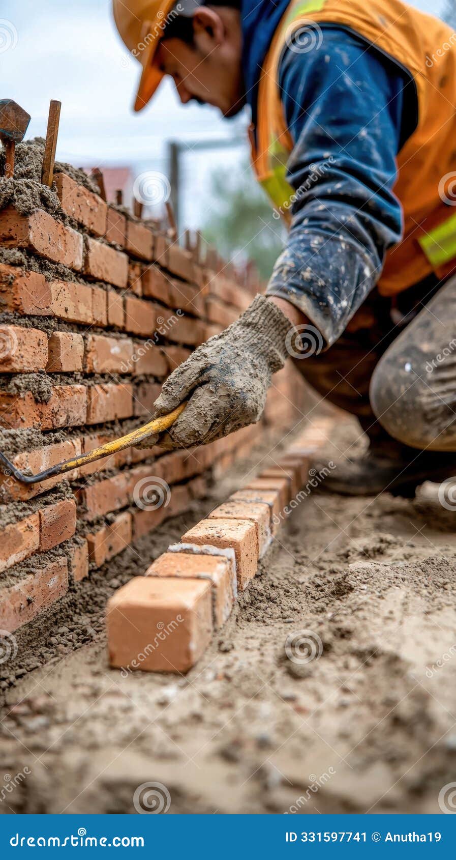 Mason Leveling Bricks With Tools In A Wide-angle Shot, Focus On Wall ...