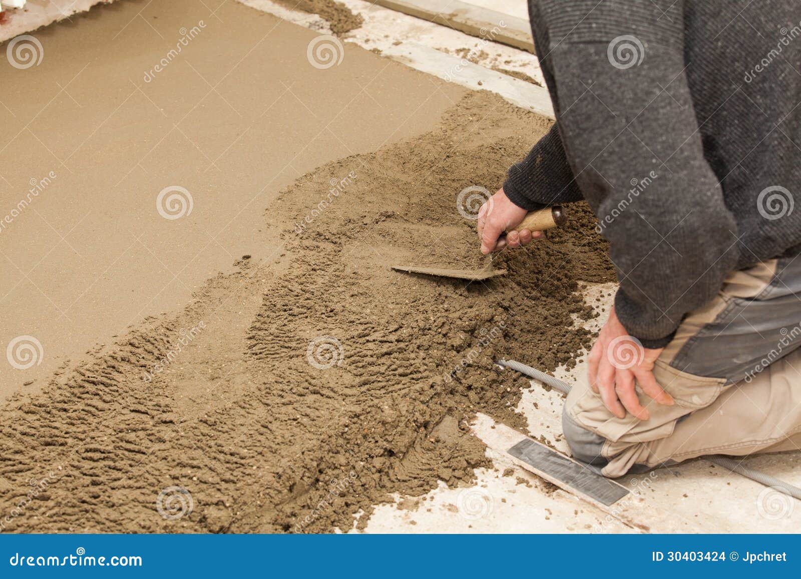 Mason Leveling Concrete With Spreading Poured Concrete Royalty-Free ...