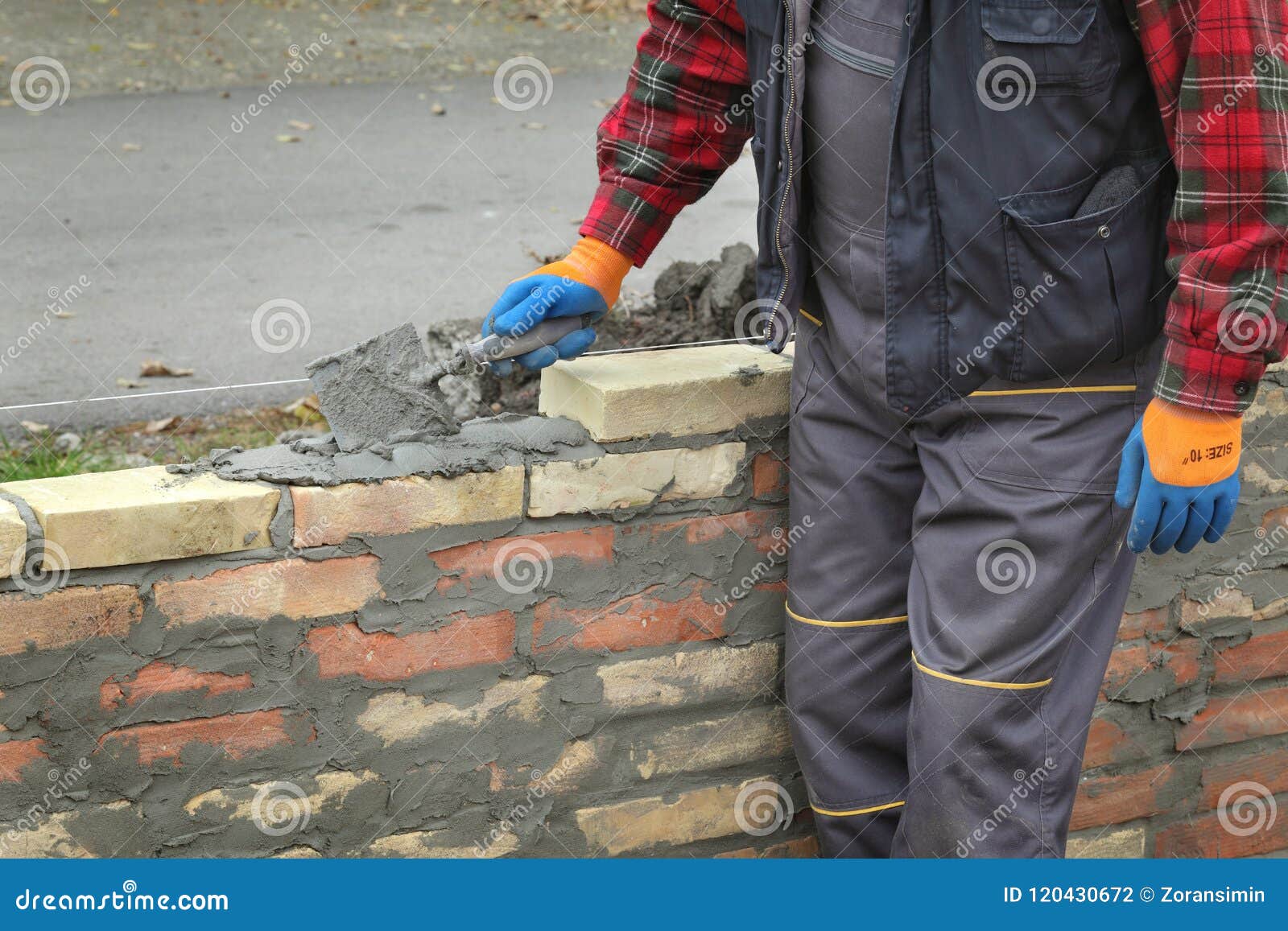 Worker Building Brick Wall Using Trowel Stock Photo - Image of brick ...