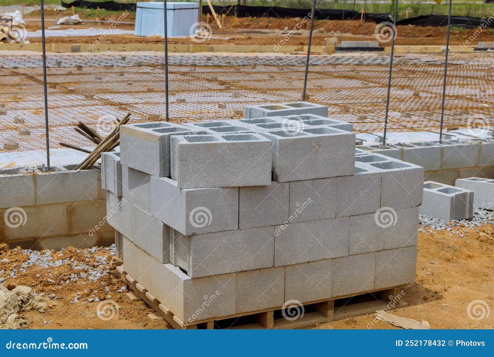 A Mason Man is Laying the Mounting a Wall of Aerated Concrete Blocks ...