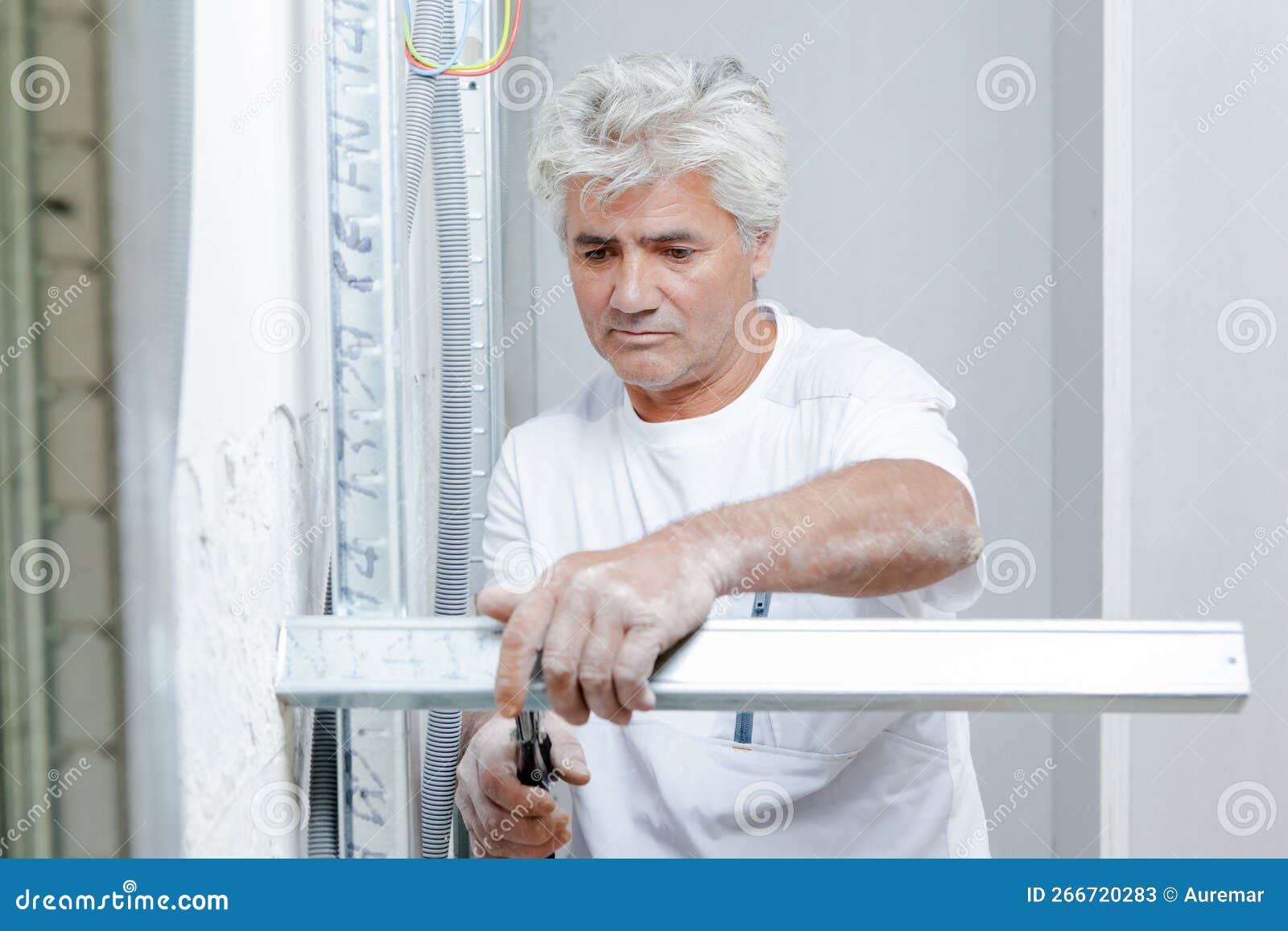 Mason using pliers stock image. Image of bricklayer - 266720283