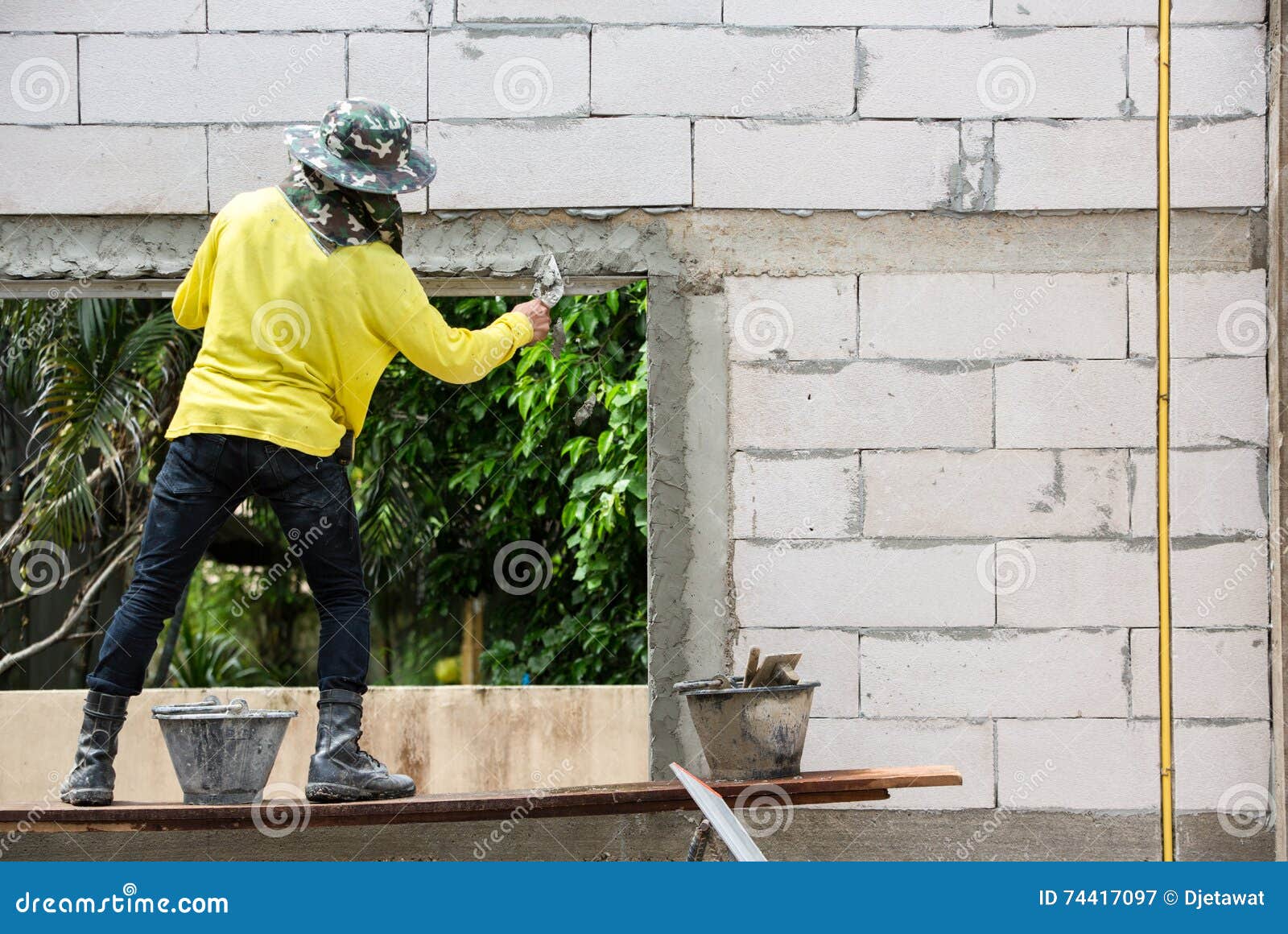 Mason Using Trowel for Plastering the Concrete To Build Wall, Co Stock ...