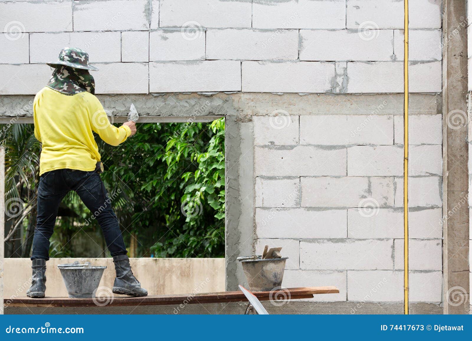 Mason Using Trowel for Plastering the Concrete To Build Wall, Co Stock ...