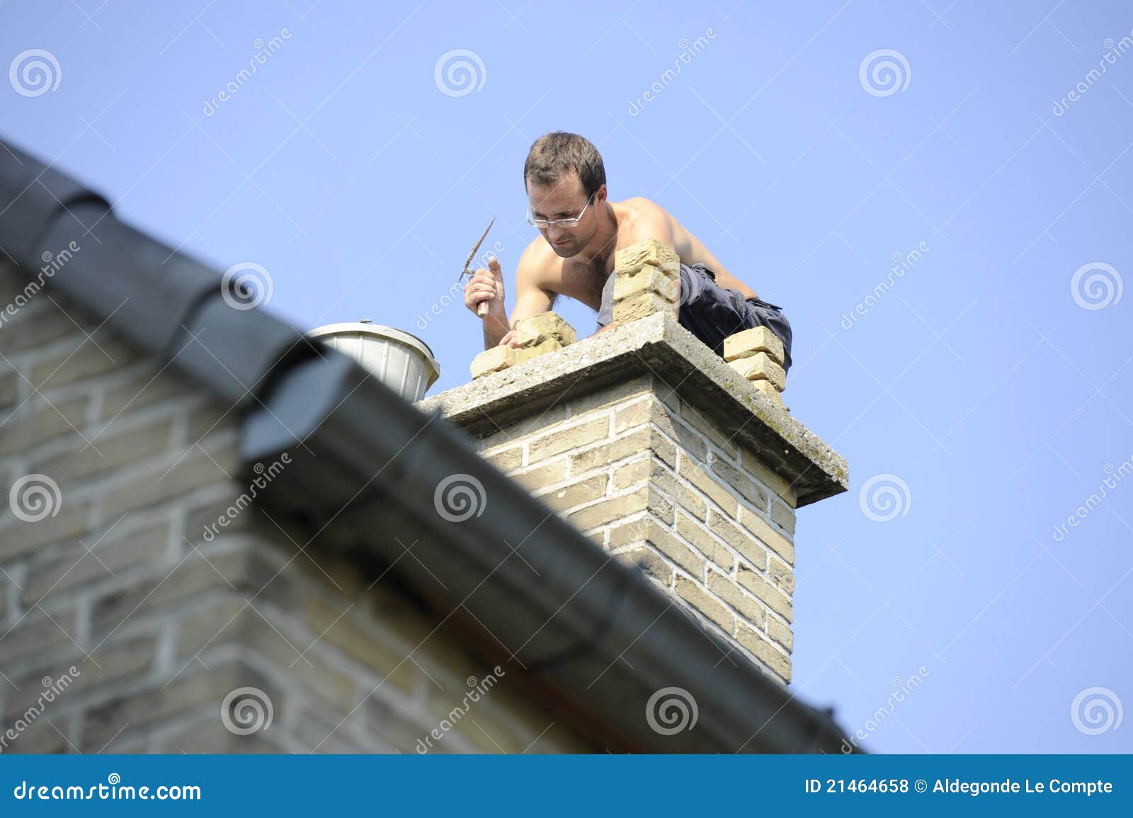 Mason working on a chimney stock photo. Image of roof - 21464658