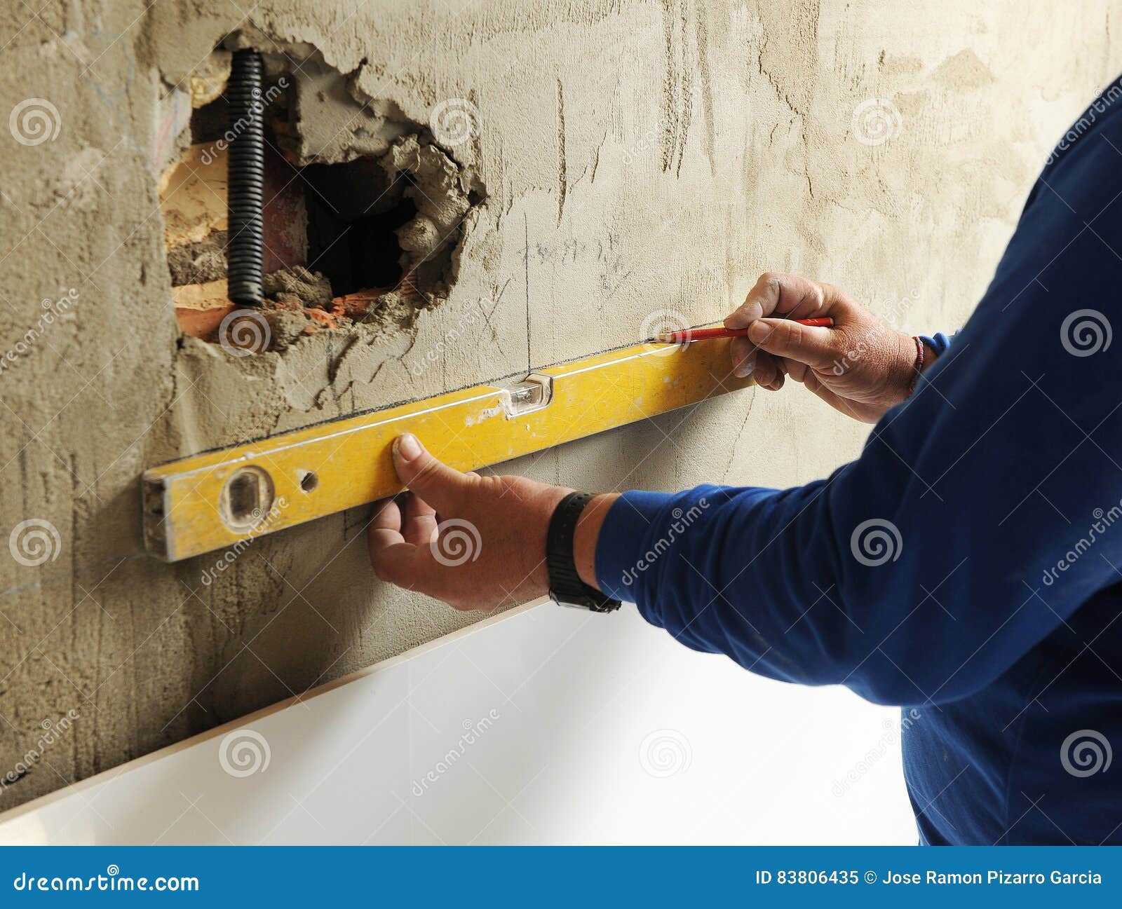 Construction Worker Marking a Horizontal Line with the Level Tool Stock ...